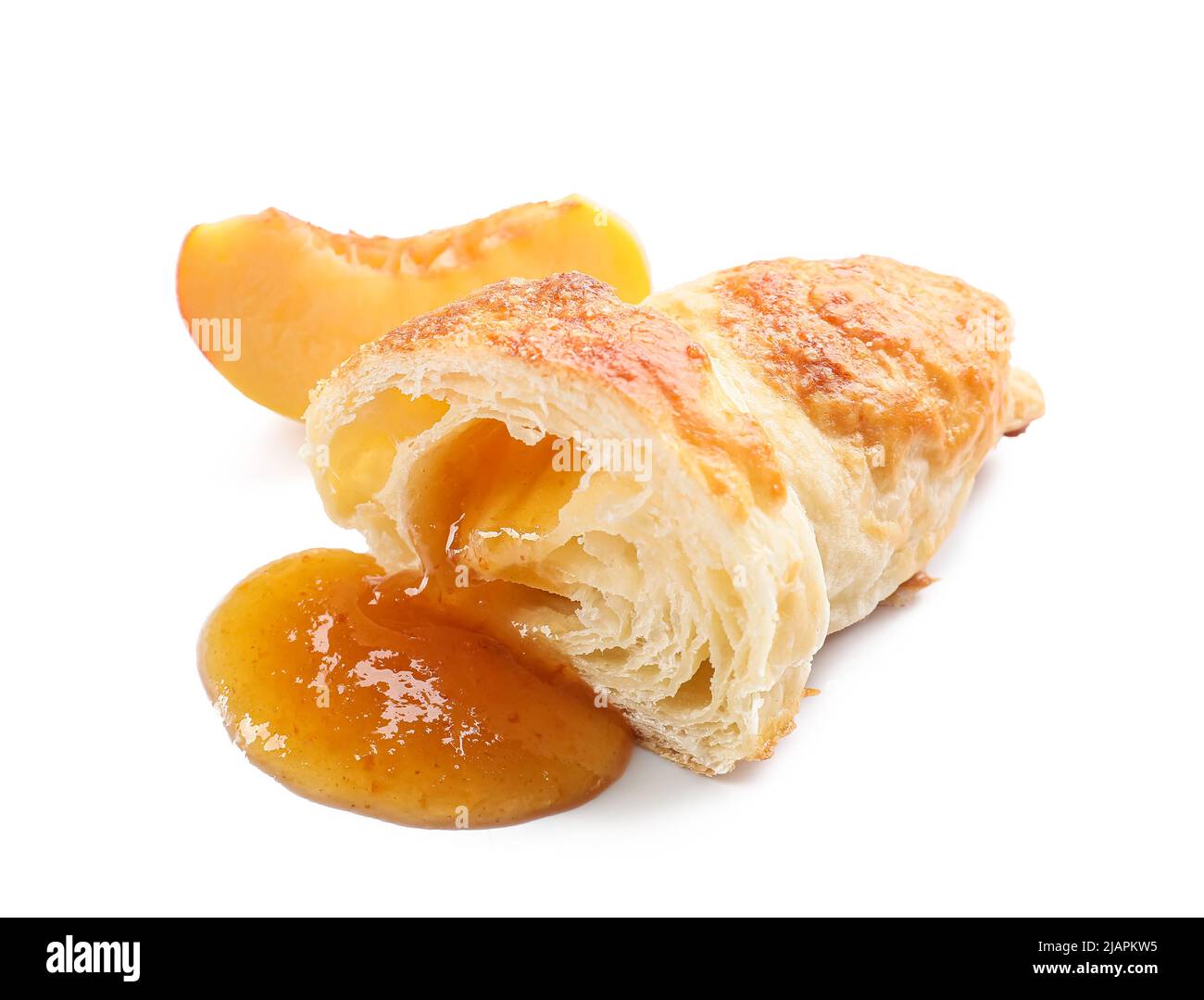 Half of delicious croissant with peach jam on white background Stock ...