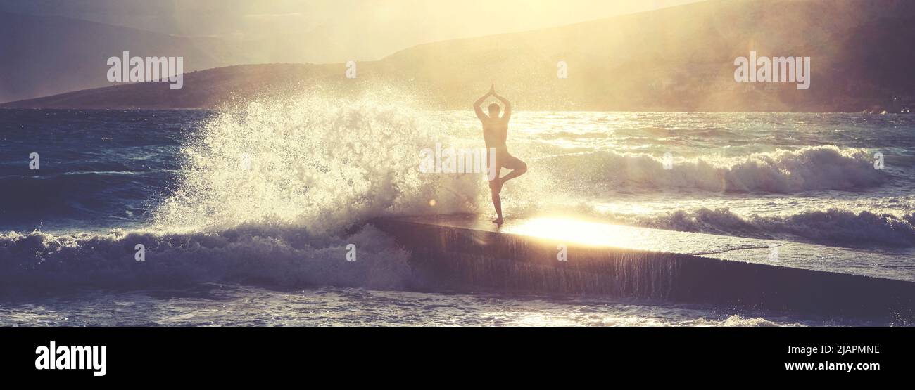 Feeling of freedom concept. Man standing on pier facing to the sea with ...
