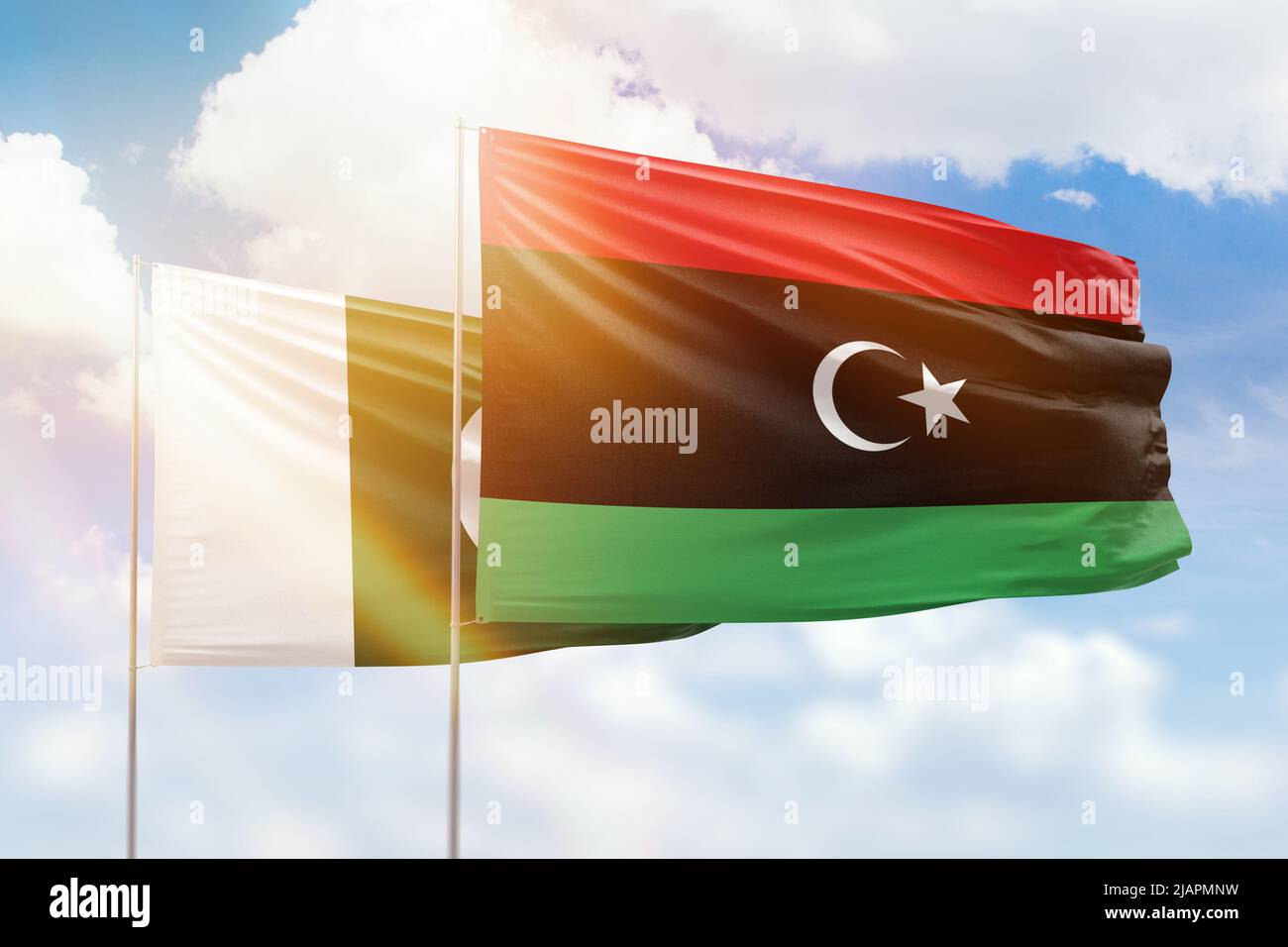 Sunny blue sky and flags of libya and pakistan Stock Photo - Alamy