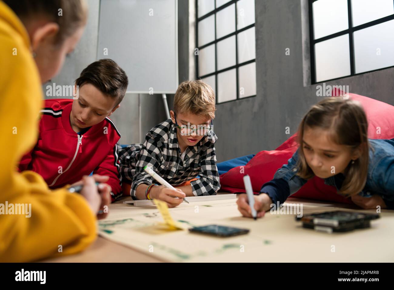 Boy girl school working together hi-res stock photography and images ...