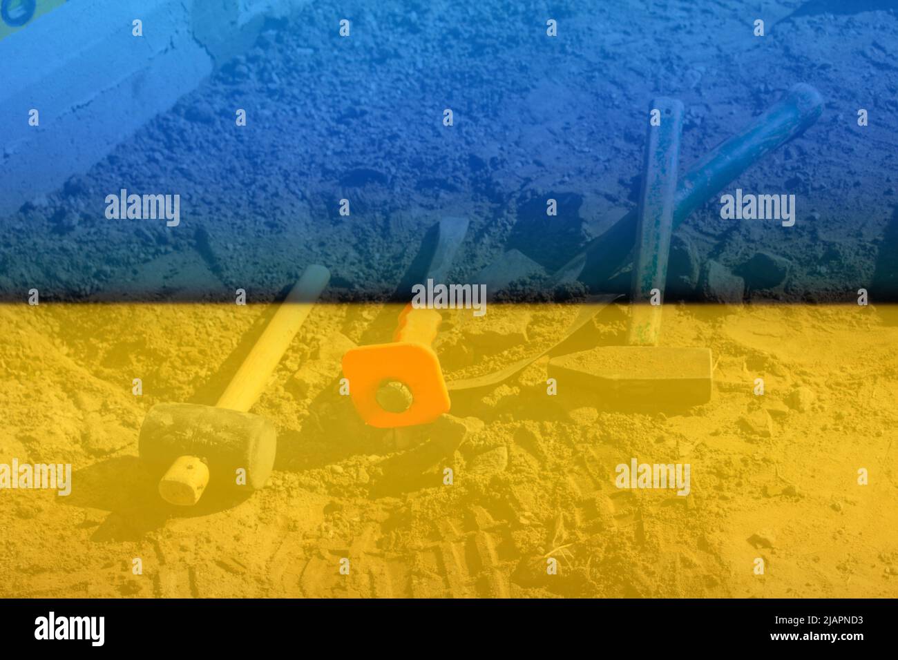 Defocus hammer, mallet, chisel and bayonet of the shovel lie on the ...