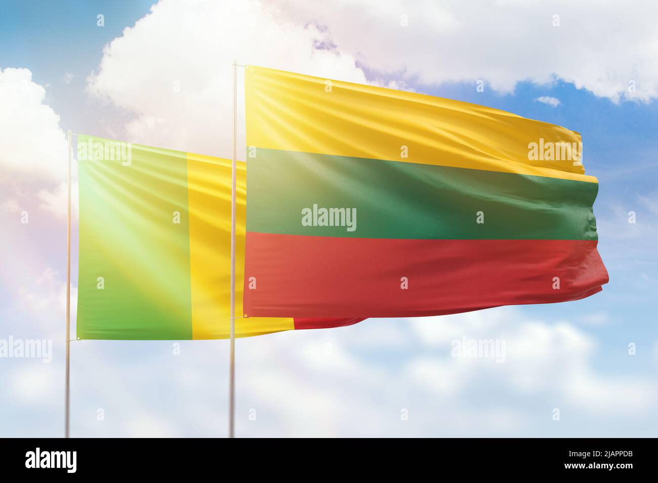 Sunny blue sky and flags of lithuania and mali Stock Photo - Alamy