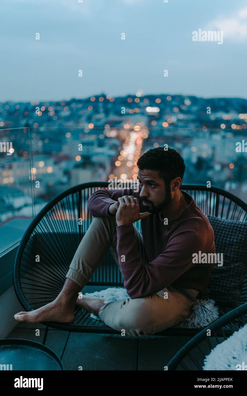 Man balcony and sad hi-res stock photography and images - Alamy