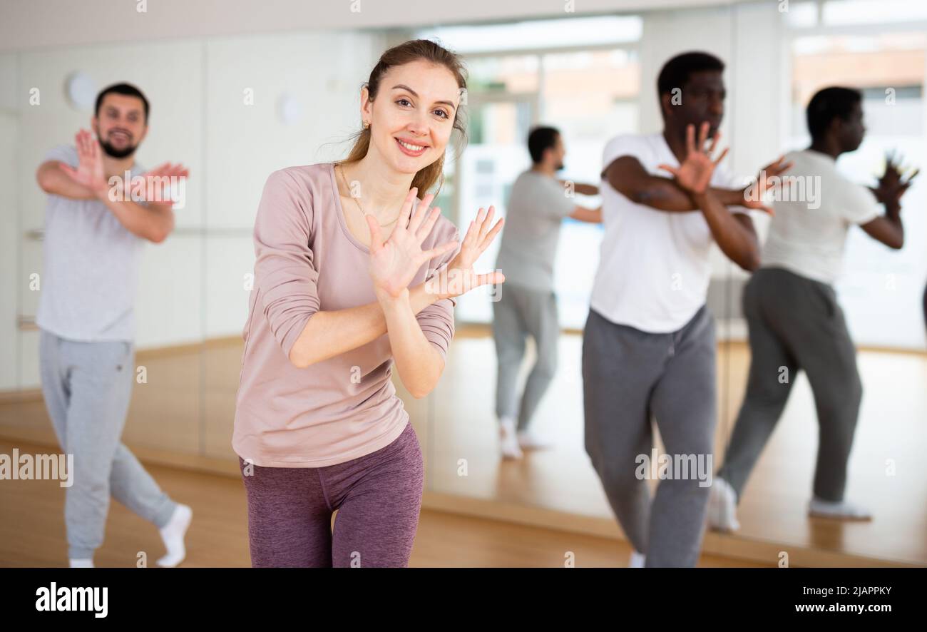 Young woman enjoying active dancing in dance studio Stock Photo - Alamy