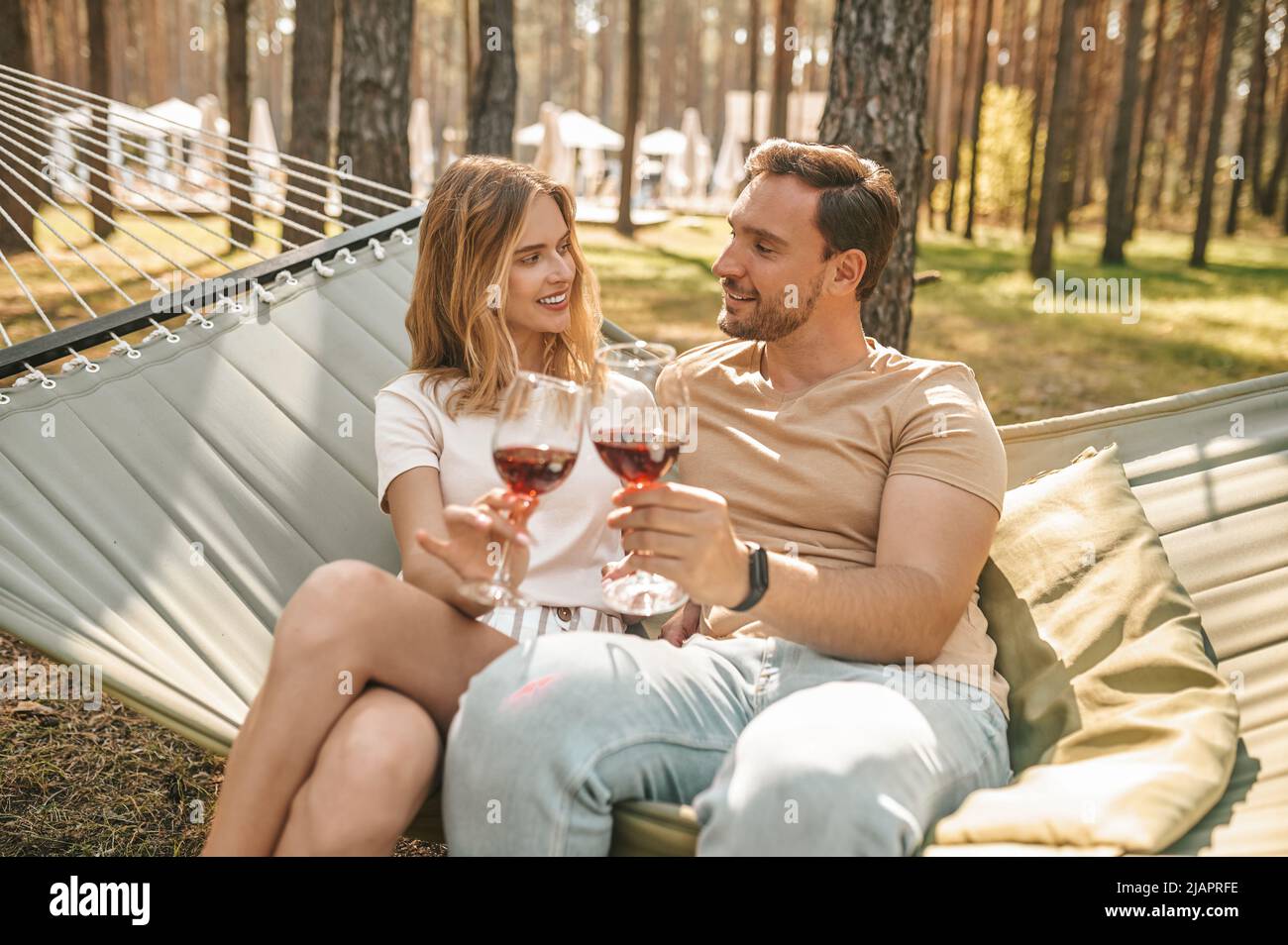 Caucasian couple clinking glasses in hi-res stock photography and images - Alamy