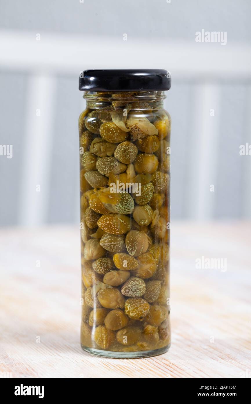 Pickled capers in glass jar Stock Photo - Alamy