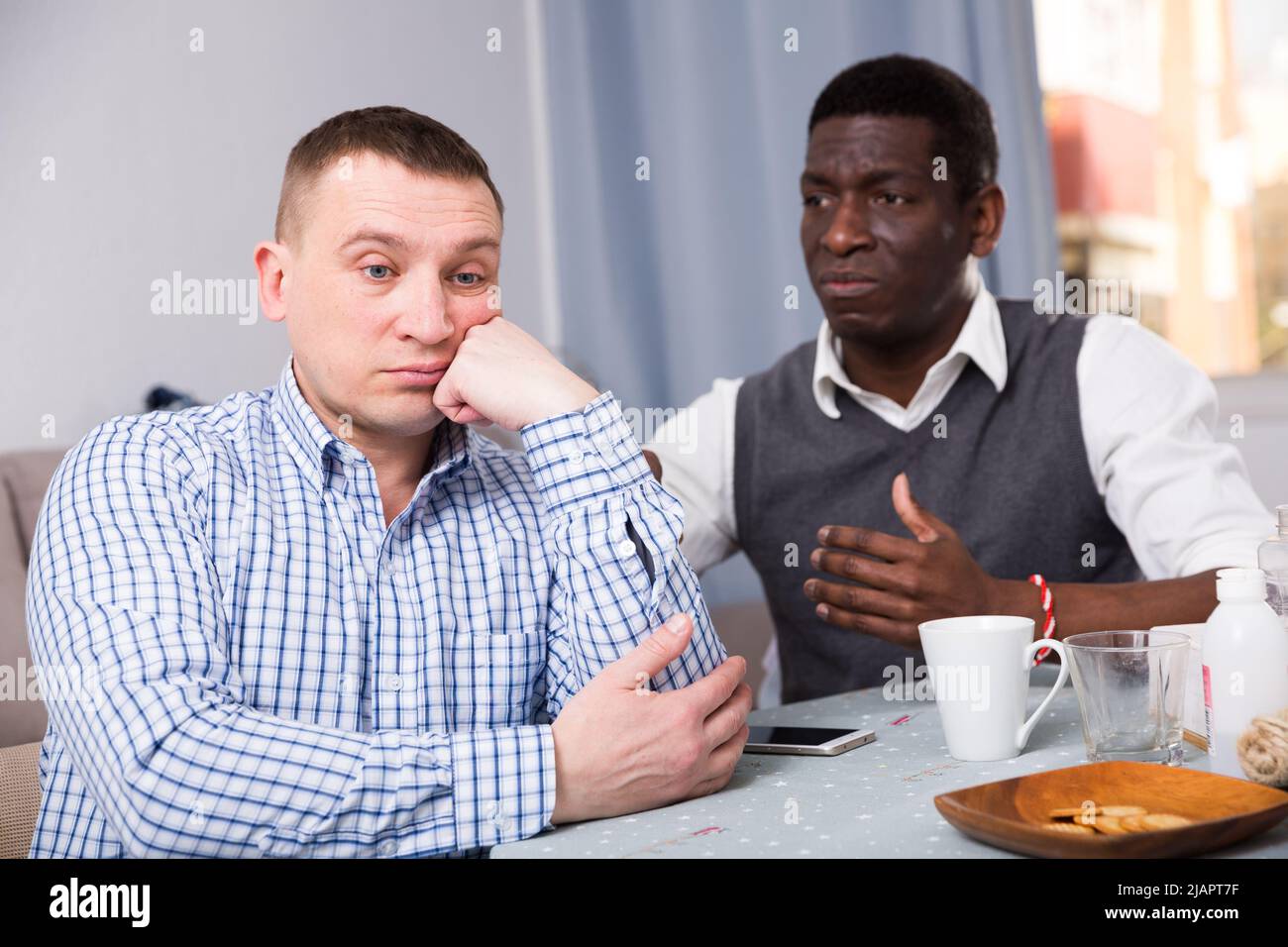 Man friends consoling hi-res stock photography and images - Alamy