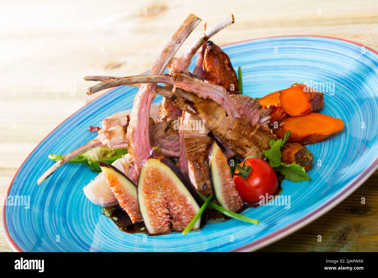 Roasted ribs of mutton with figs, vegetables, sauce demi-glace Stock ...