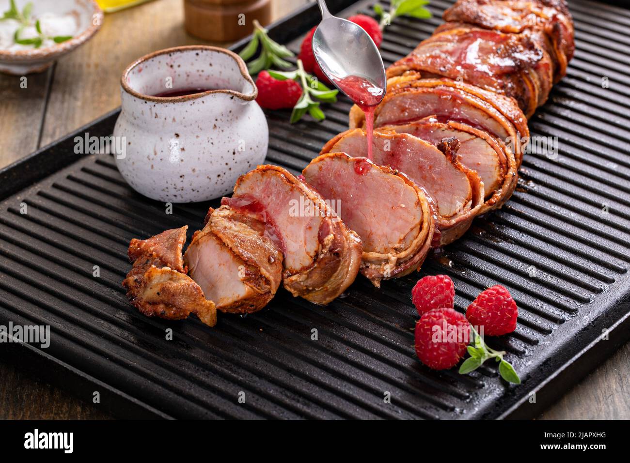 Bacon wrapped pork tenderloin with raspberry vinaigrette Stock Photo ...