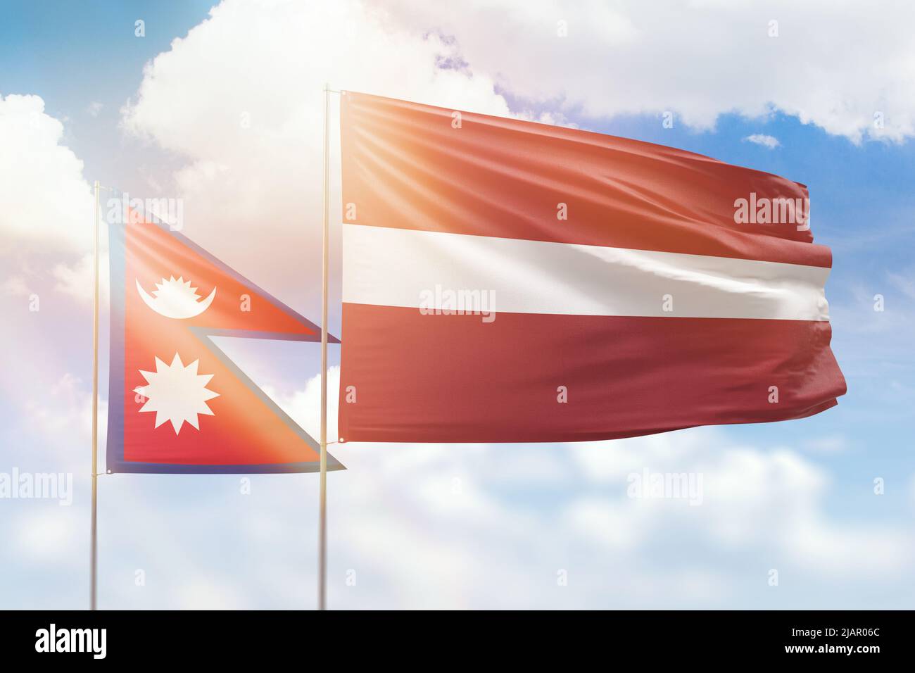 Sunny blue sky and flags of latvia and nepal Stock Photo - Alamy