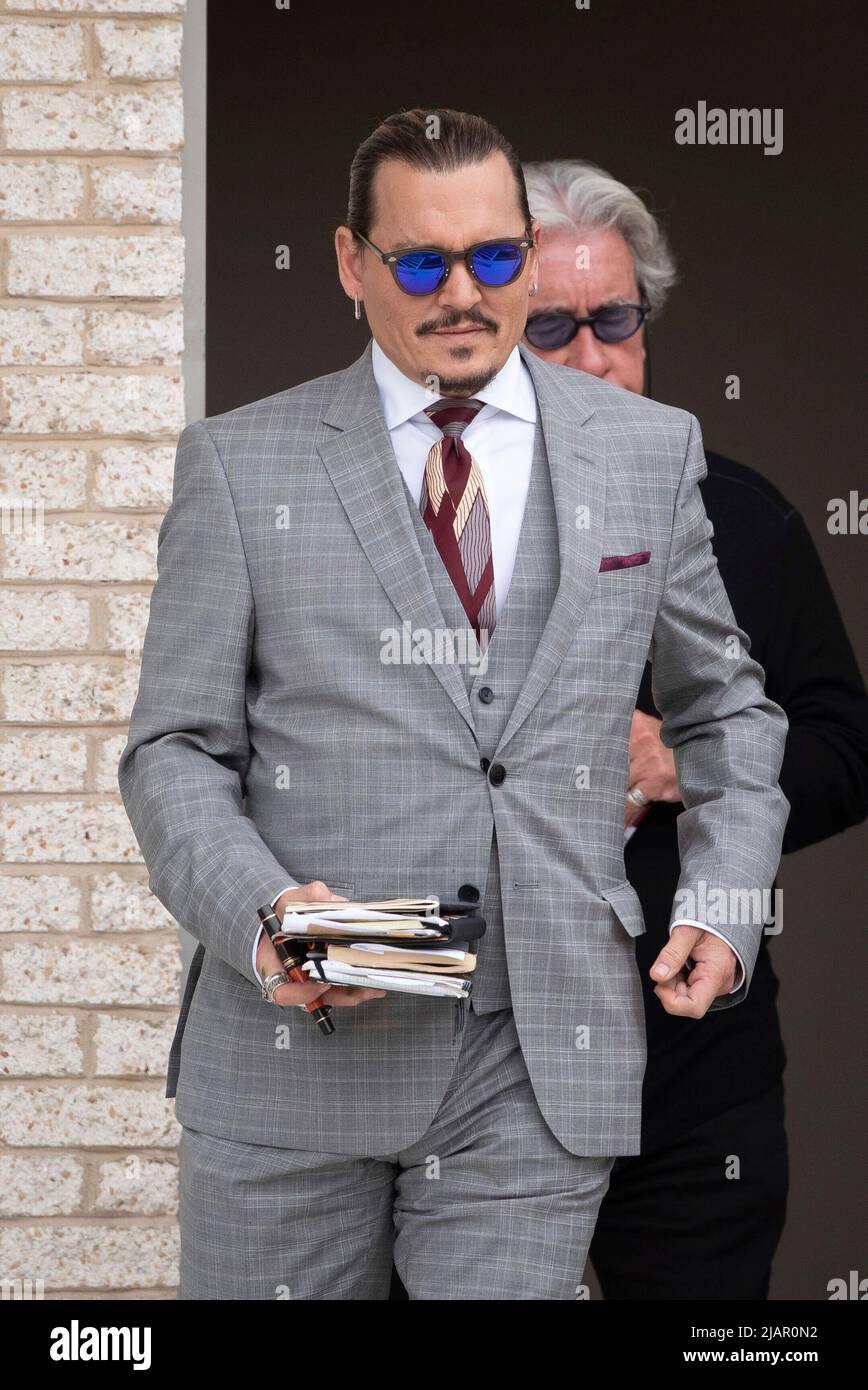 Johnny Depp walks outside during a court recess, at the Fairfax County ...