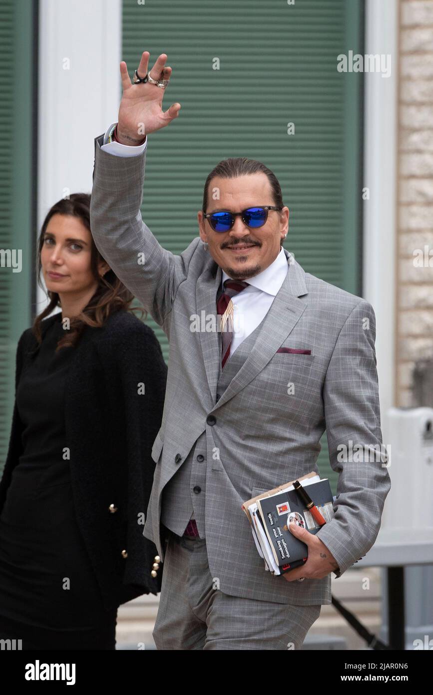 Johnny Depp walks outside during a court recess, at the Fairfax County ...