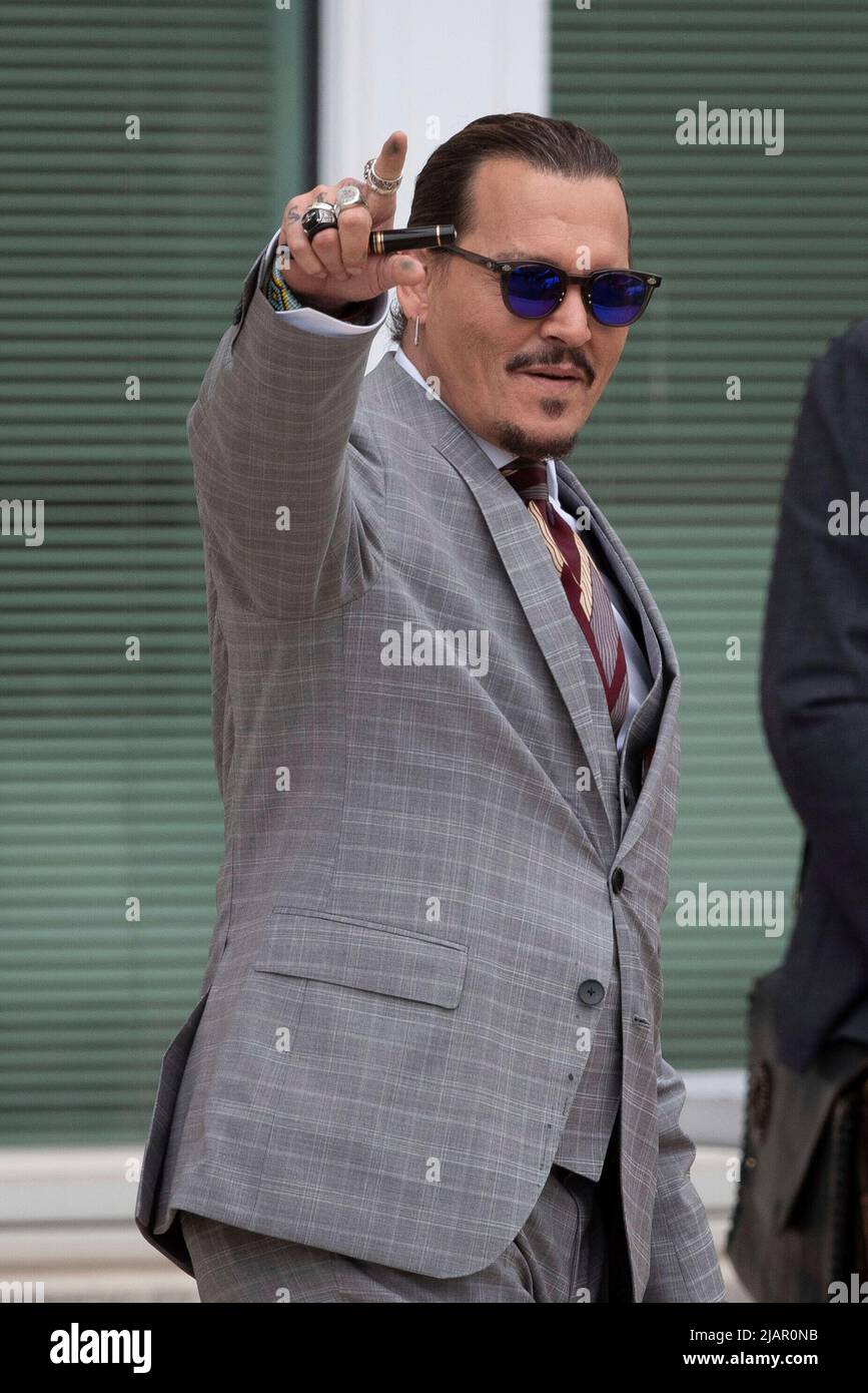 Johnny Depp walks outside during a court recess, at the Fairfax County ...