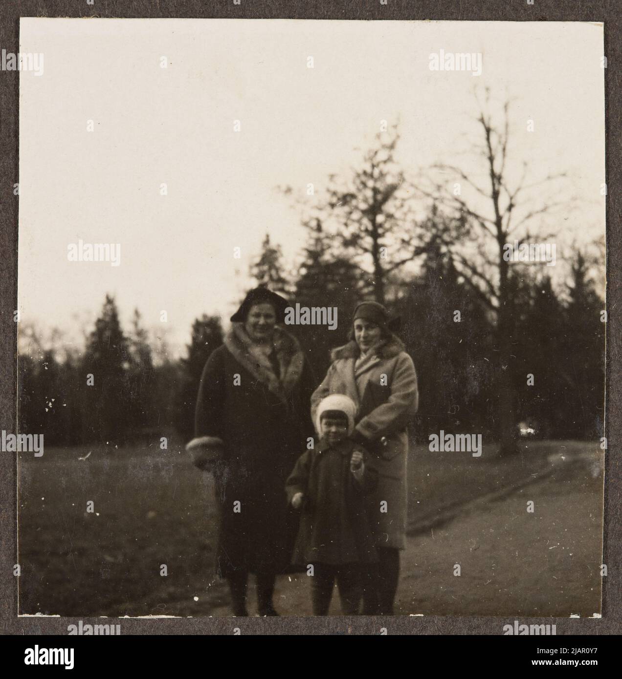 Two women and a child against the background of the landscape. Circle ...