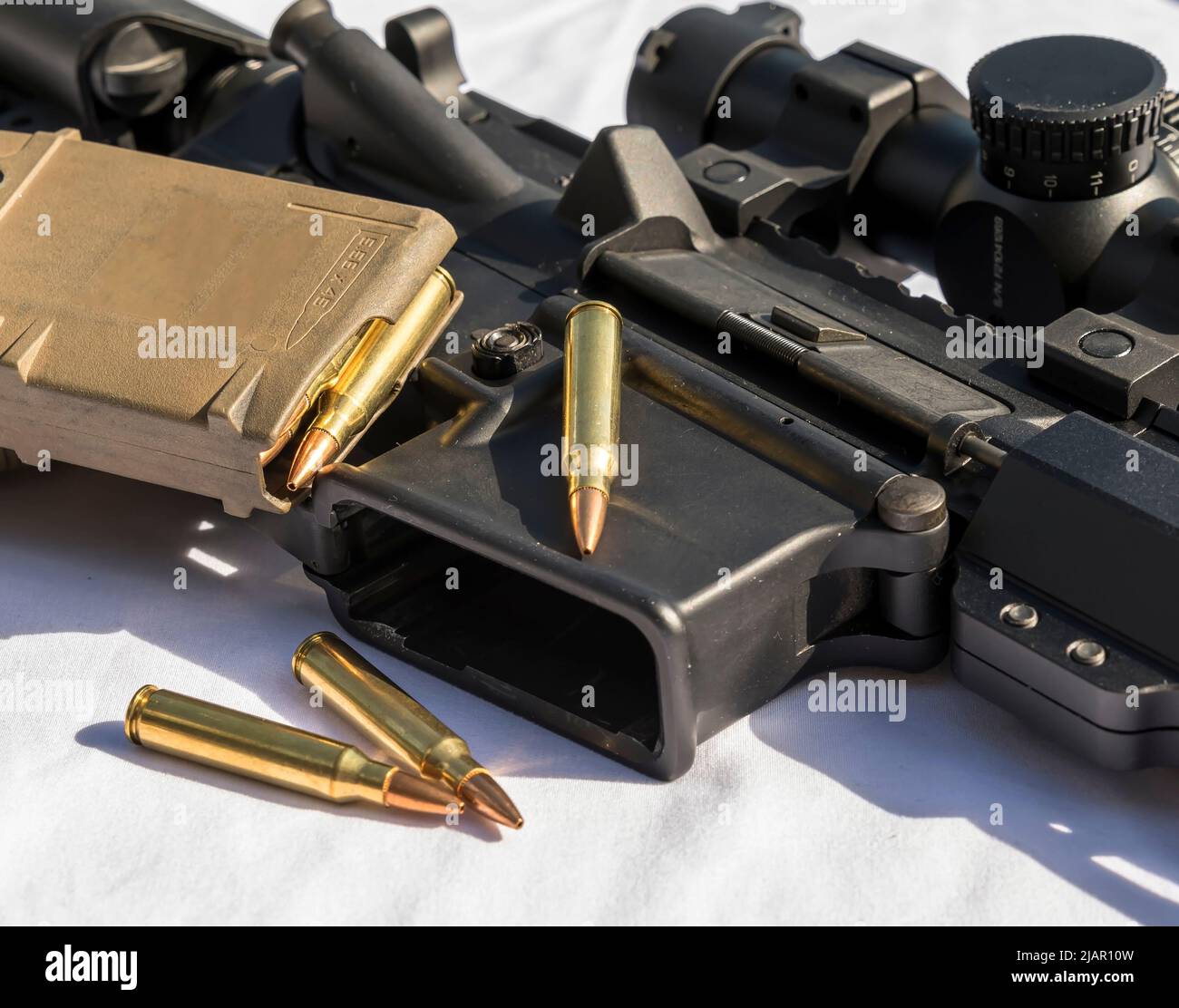 A rifle magazine loaded with 223 caliber bullets on a AR15 rifle with ...