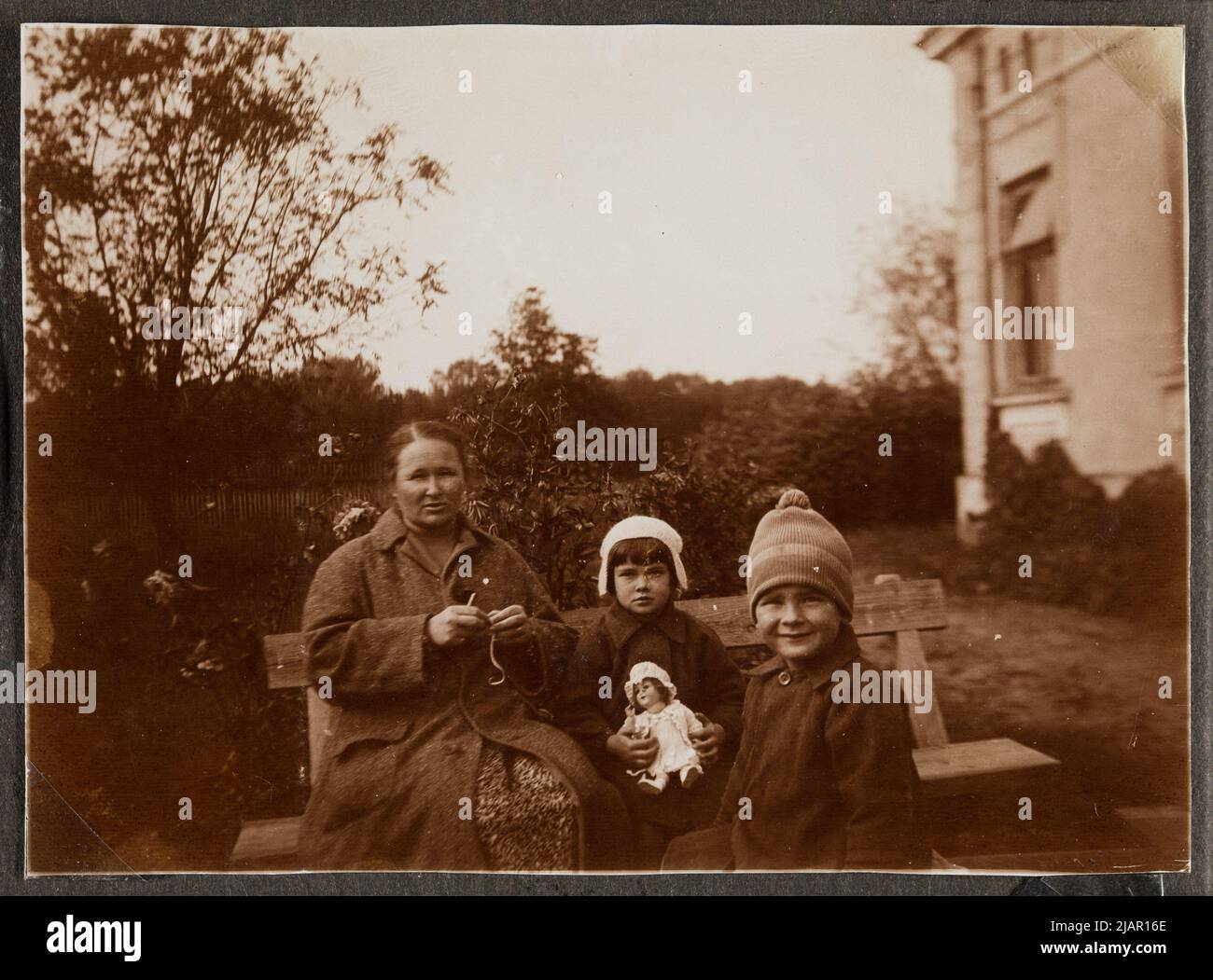 Stachiewiczowa Helena with children weapons sitting on a bench with her ...