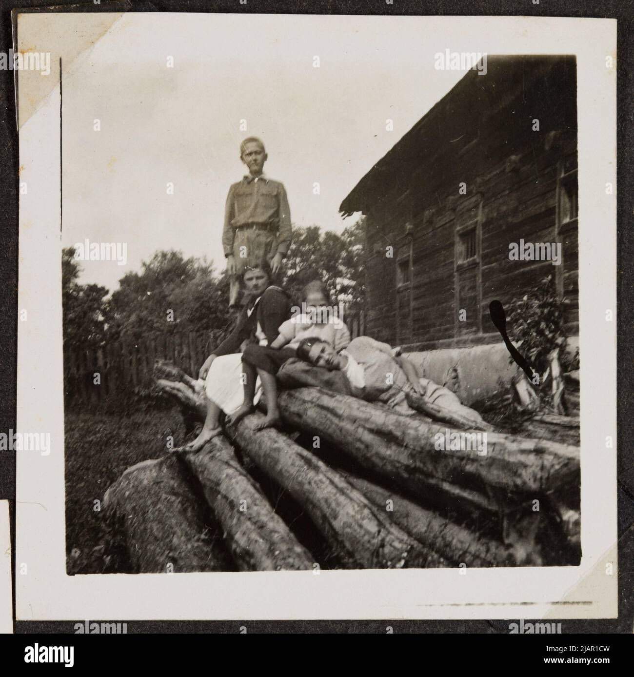 Four young people on a pile of wooden logs Circle of the Stachiewicz ...