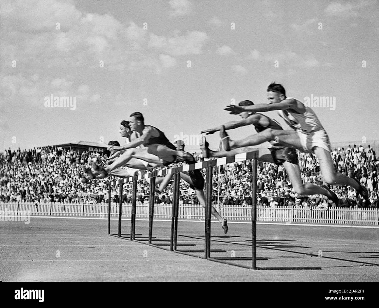 Men running hurdles at the 1938 Empire Games Stock Photo - Alamy