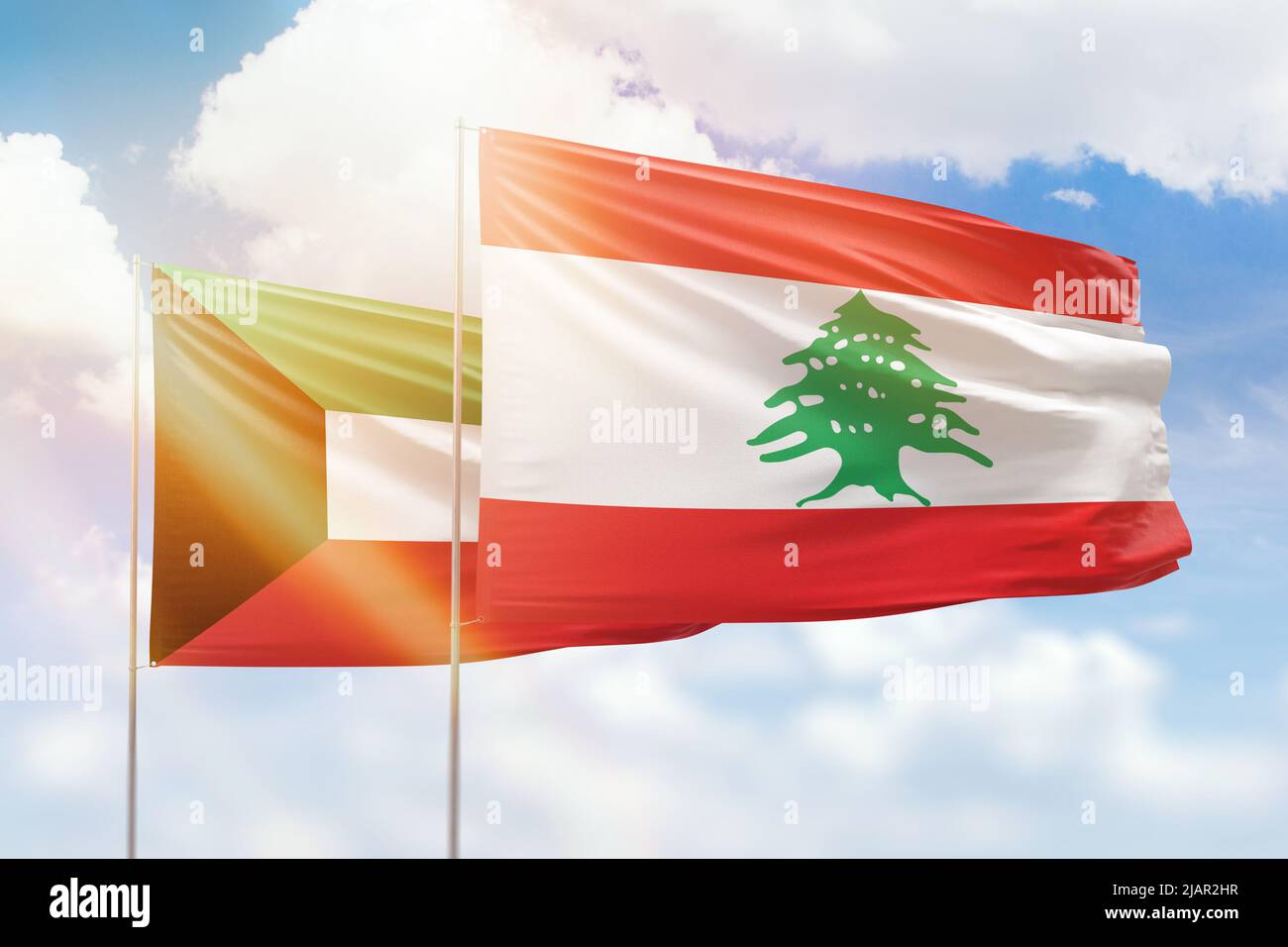 Sunny blue sky and flags of lebanon and kuwait Stock Photo - Alamy