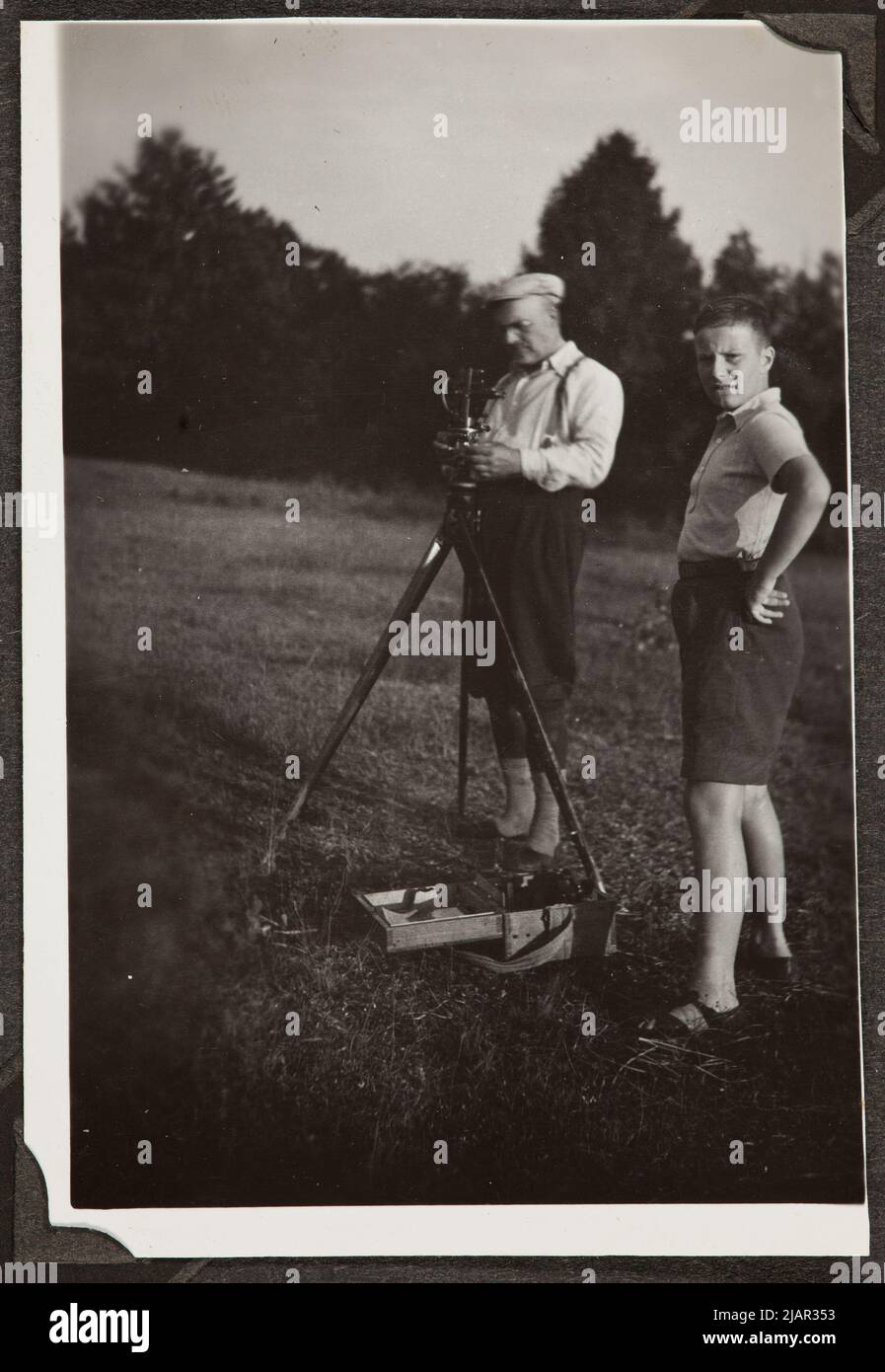 Stachiewicz Roman with his son Roman Jun. standing in the field with a ...