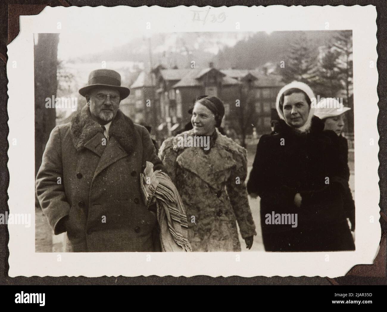 Stachiewicz Roman Sen. in a winter coat walking down the street of a ...