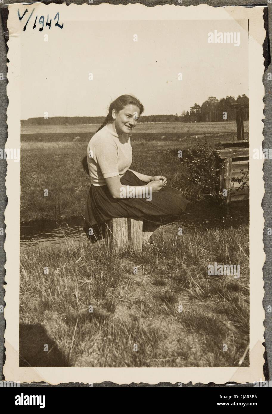 Stachiewiczówna Bronisława at the age of sixteen sitting on a wooden ...