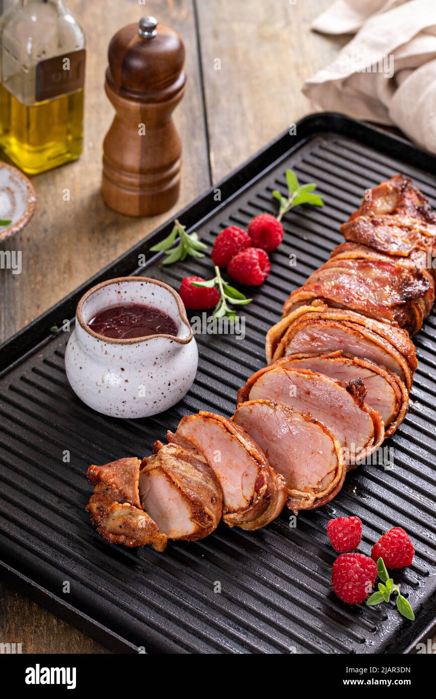 Bacon wrapped pork tenderloin with raspberry vinaigrette Stock Photo ...
