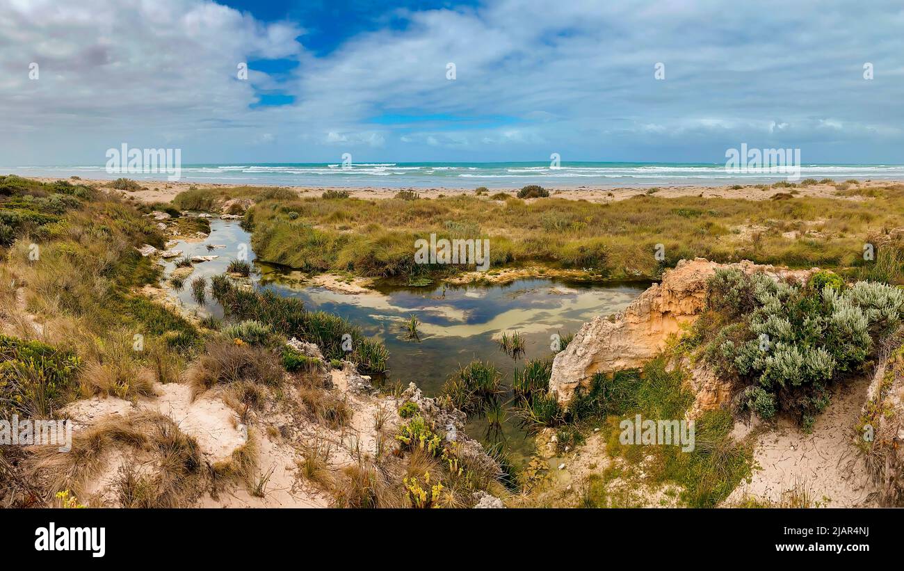 The rocks, waves and spectacular sky of the rugged isolated coastline ...
