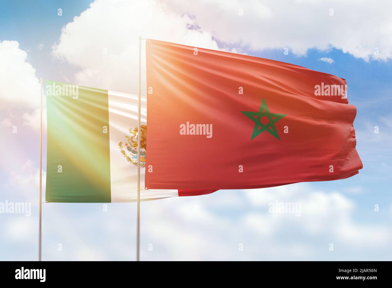 Sunny blue sky and flags of morocco and mexico Stock Photo - Alamy