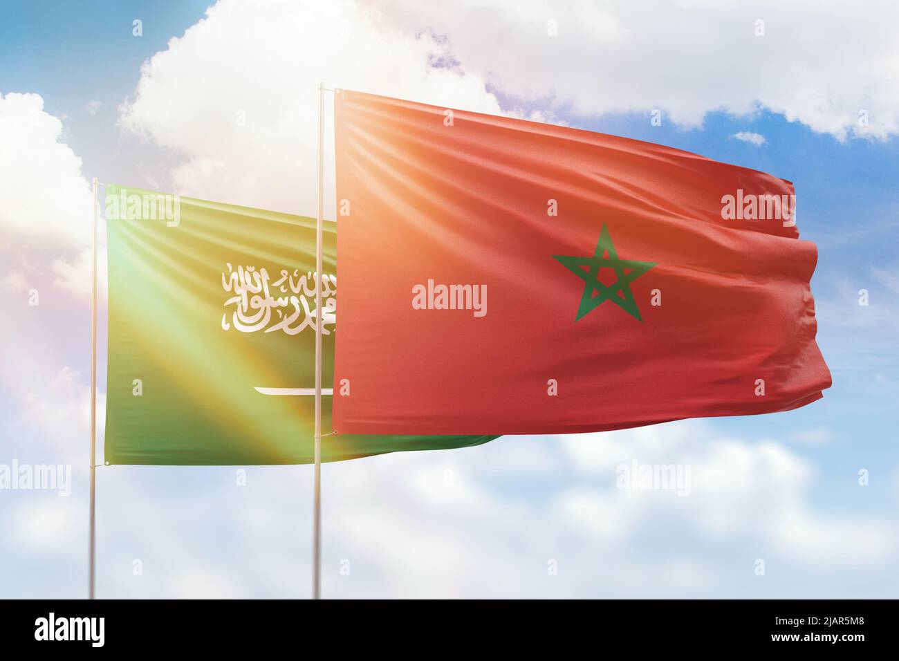 Sunny blue sky and flags of morocco and saudi arabia Stock Photo - Alamy