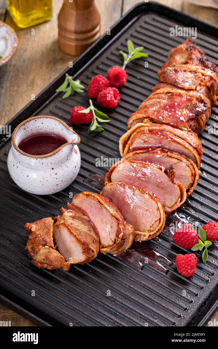 Bacon wrapped pork tenderloin with raspberry vinaigrette Stock Photo ...