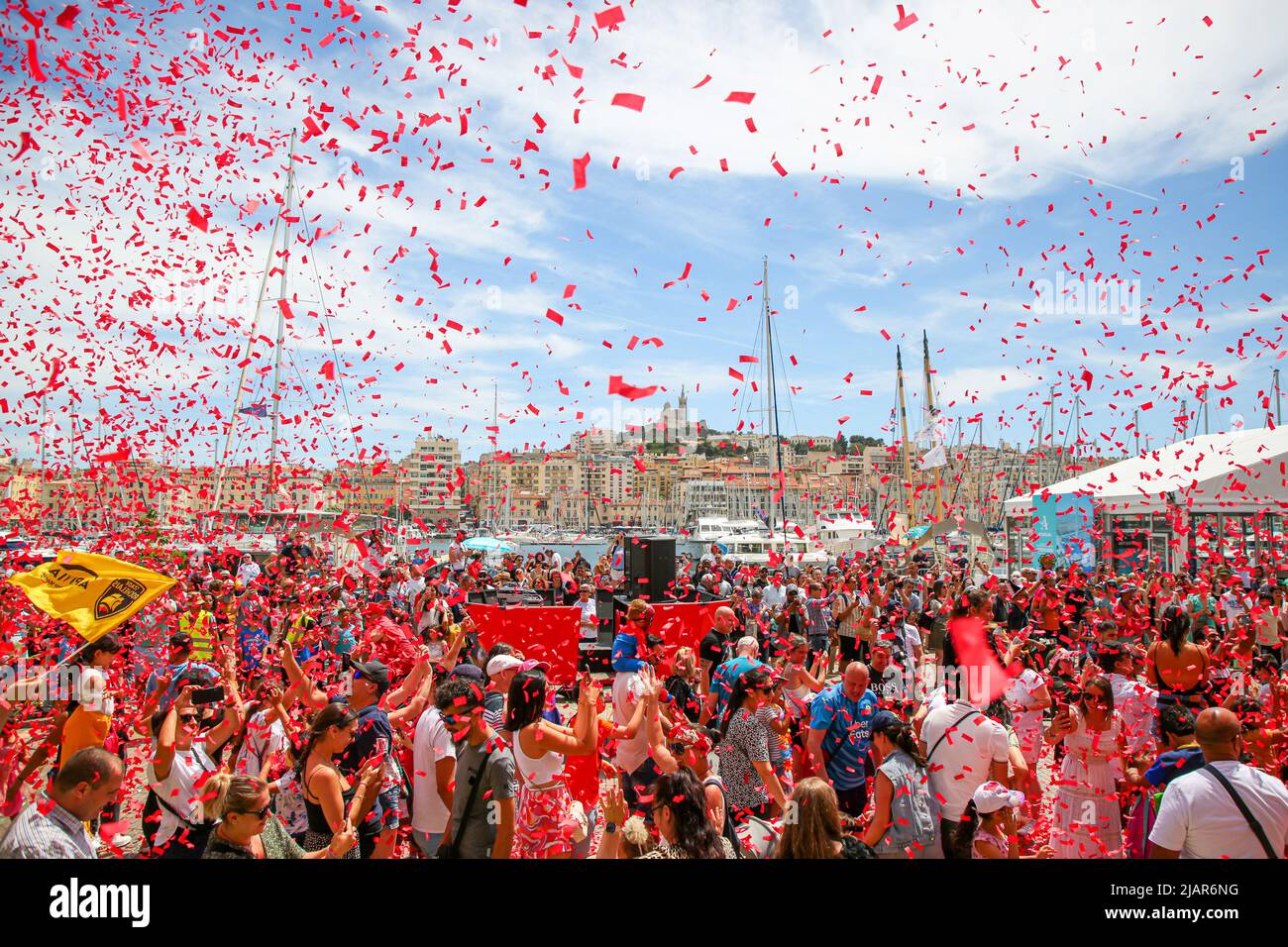 Marseille, France. 28th May, 2022. Carnival-goers parade under a shower ...