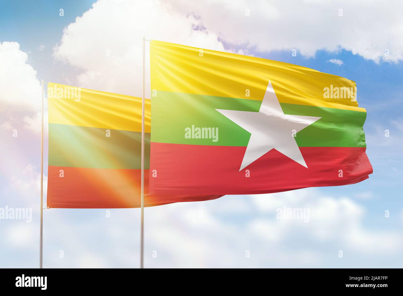 Sunny blue sky and flags of myanmar and lithuania Stock Photo - Alamy