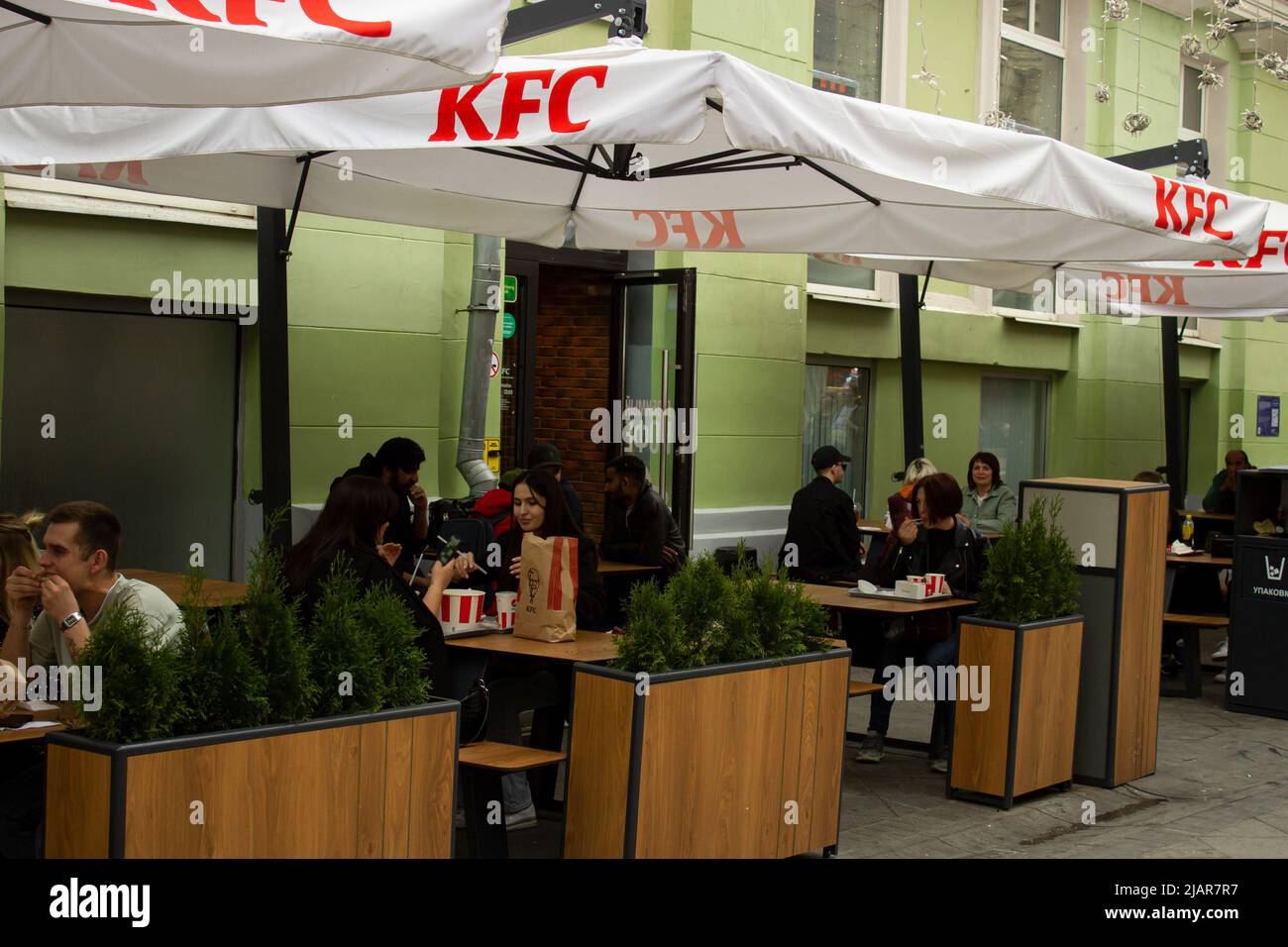 Moscow, Russia. 30th May, 2022. People eat at a KFC restaurant near the ...