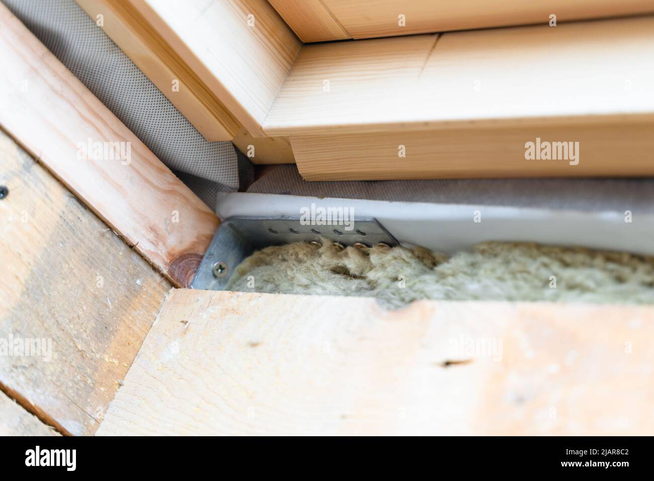Roof window installation. Roof insulation with mineral wool Stock Photo ...