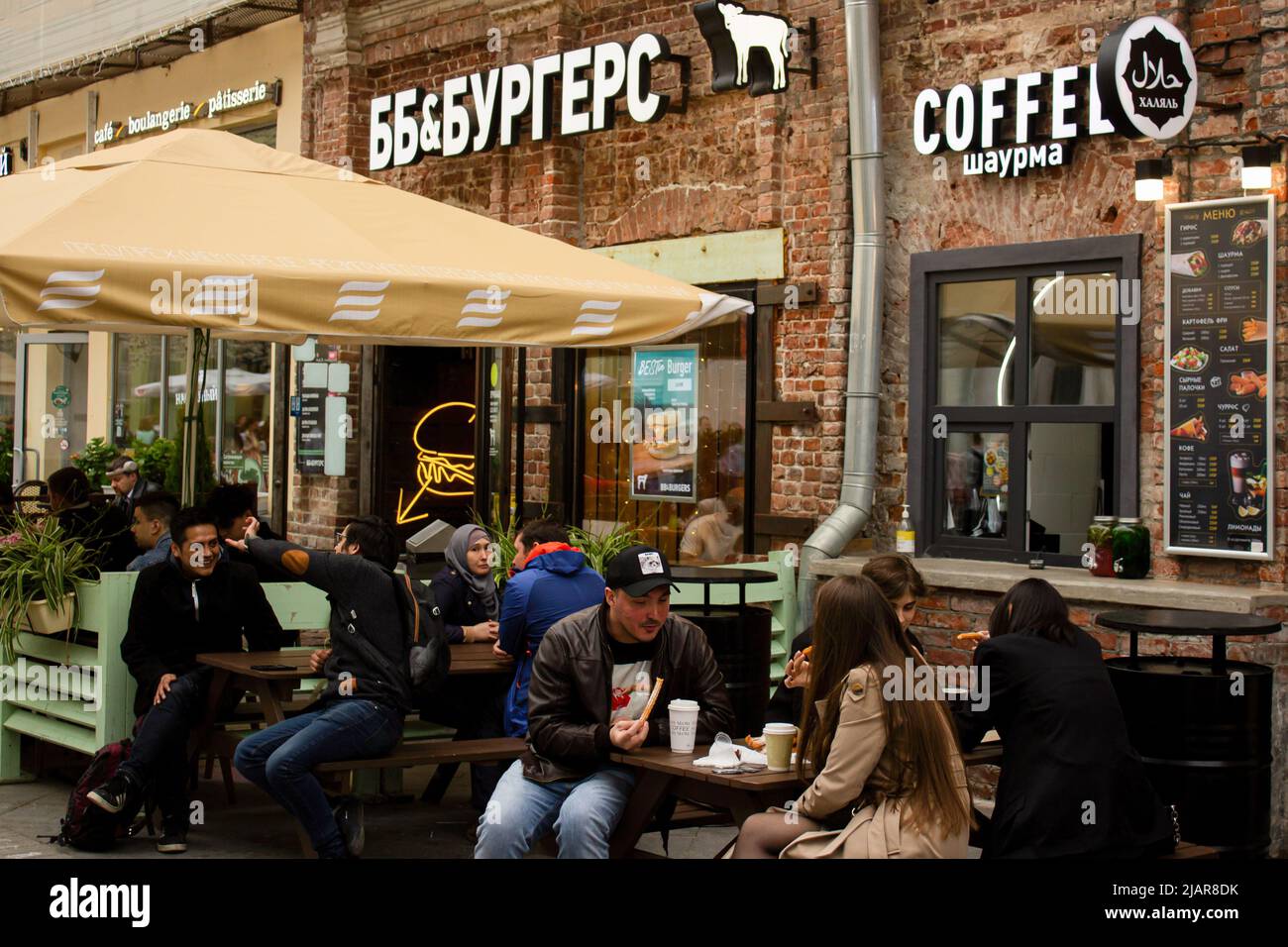 People dine at the BB&Burgers, a Russian-owned American-styled chain ...