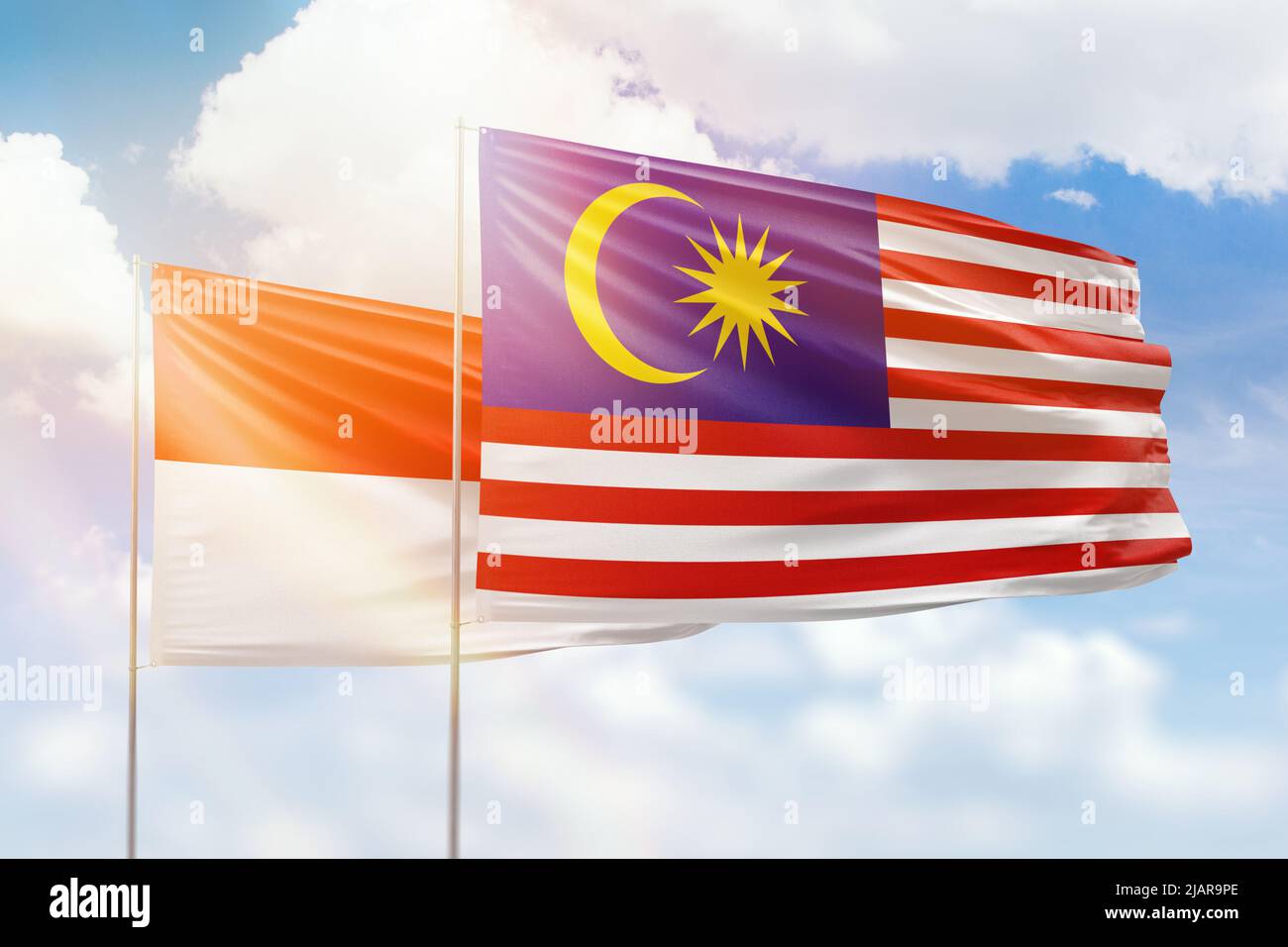 Sunny blue sky and flags of malaysia and indonesia Stock Photo - Alamy