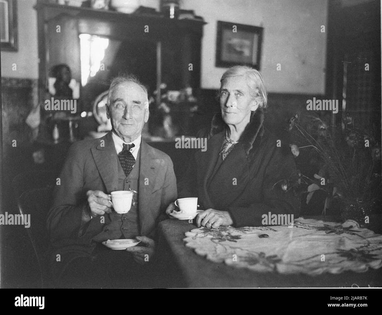 Old couple having tea ca. early 1900s Stock Photo - Alamy
