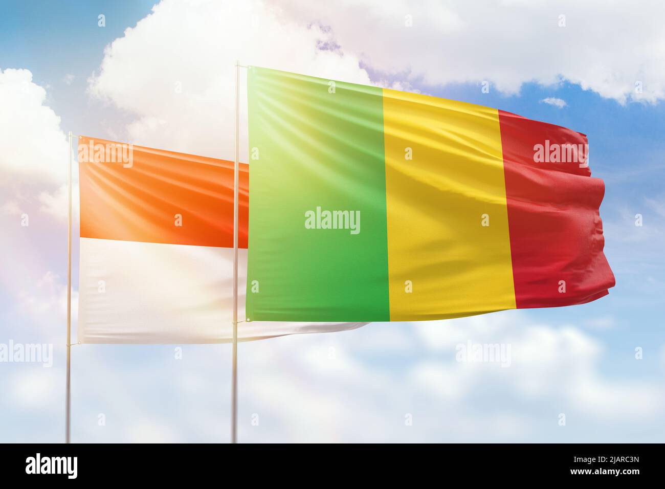 Sunny blue sky and flags of mali and indonesia Stock Photo - Alamy