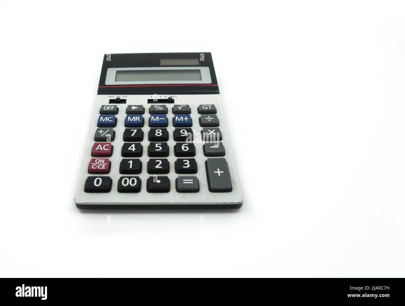 Perspective view a small old-style calculator on white background ...