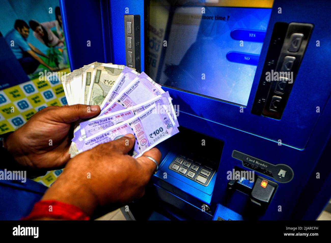 Kolkata, India. 31st May, 2022. A man seen using ATM (Automated teller ...