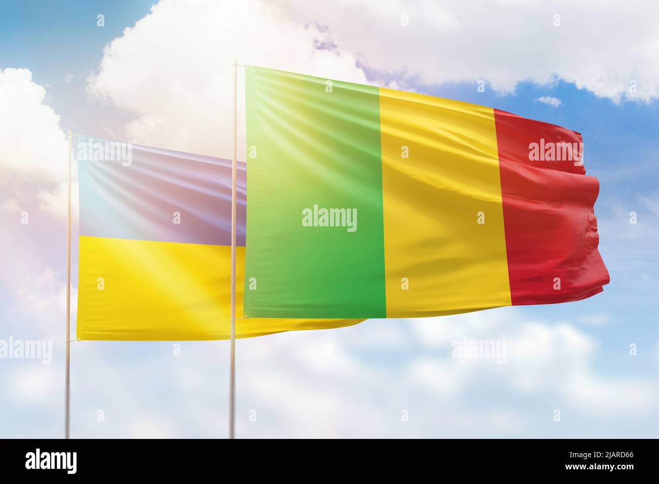 Sunny blue sky and flags of mali and ukraine Stock Photo - Alamy