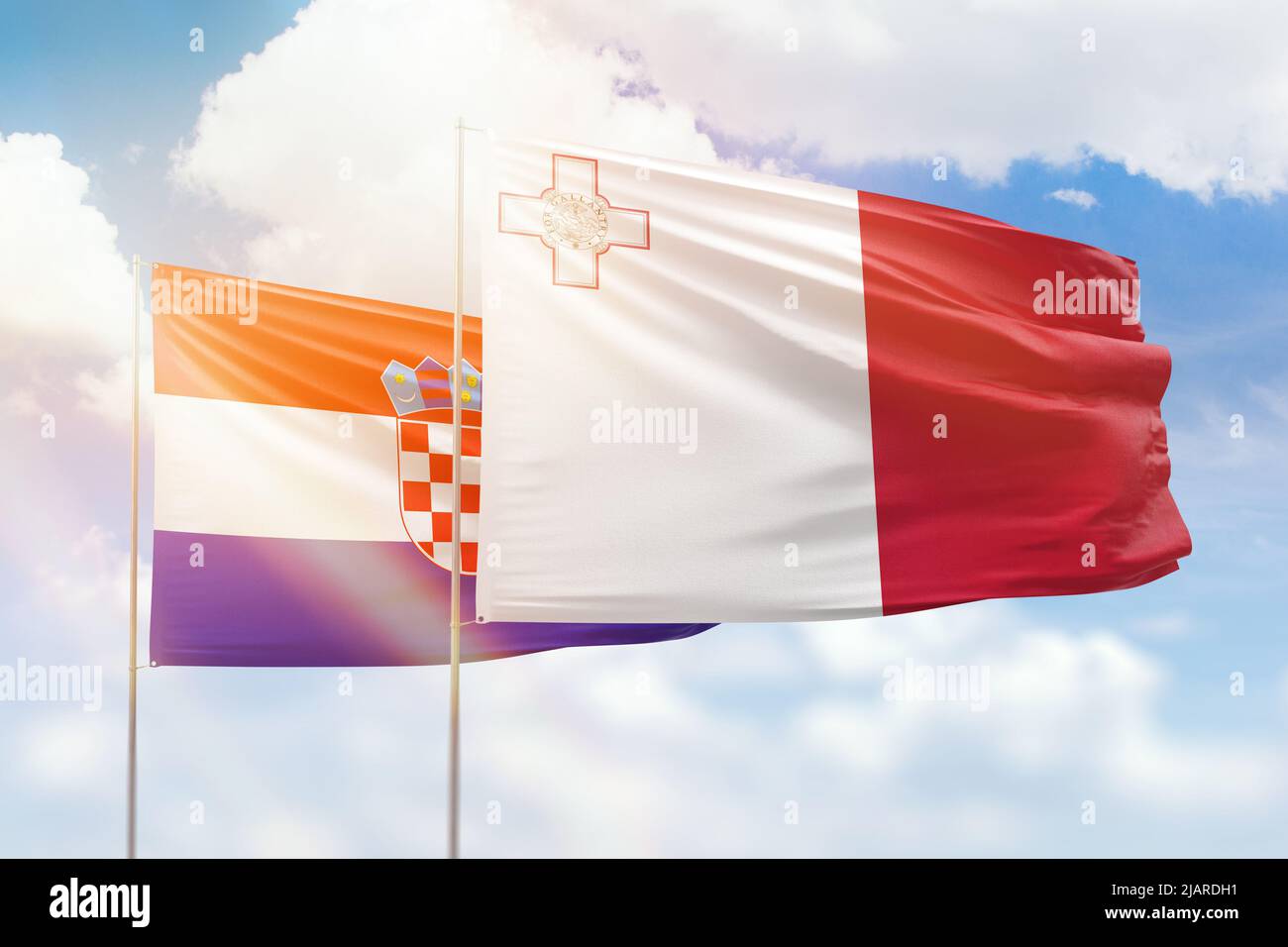 Sunny blue sky and flags of malta and croatia Stock Photo - Alamy