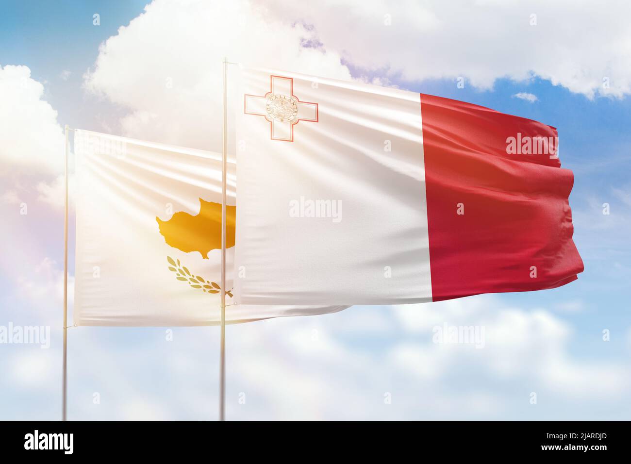 Sunny blue sky and flags of malta and cyprus Stock Photo - Alamy
