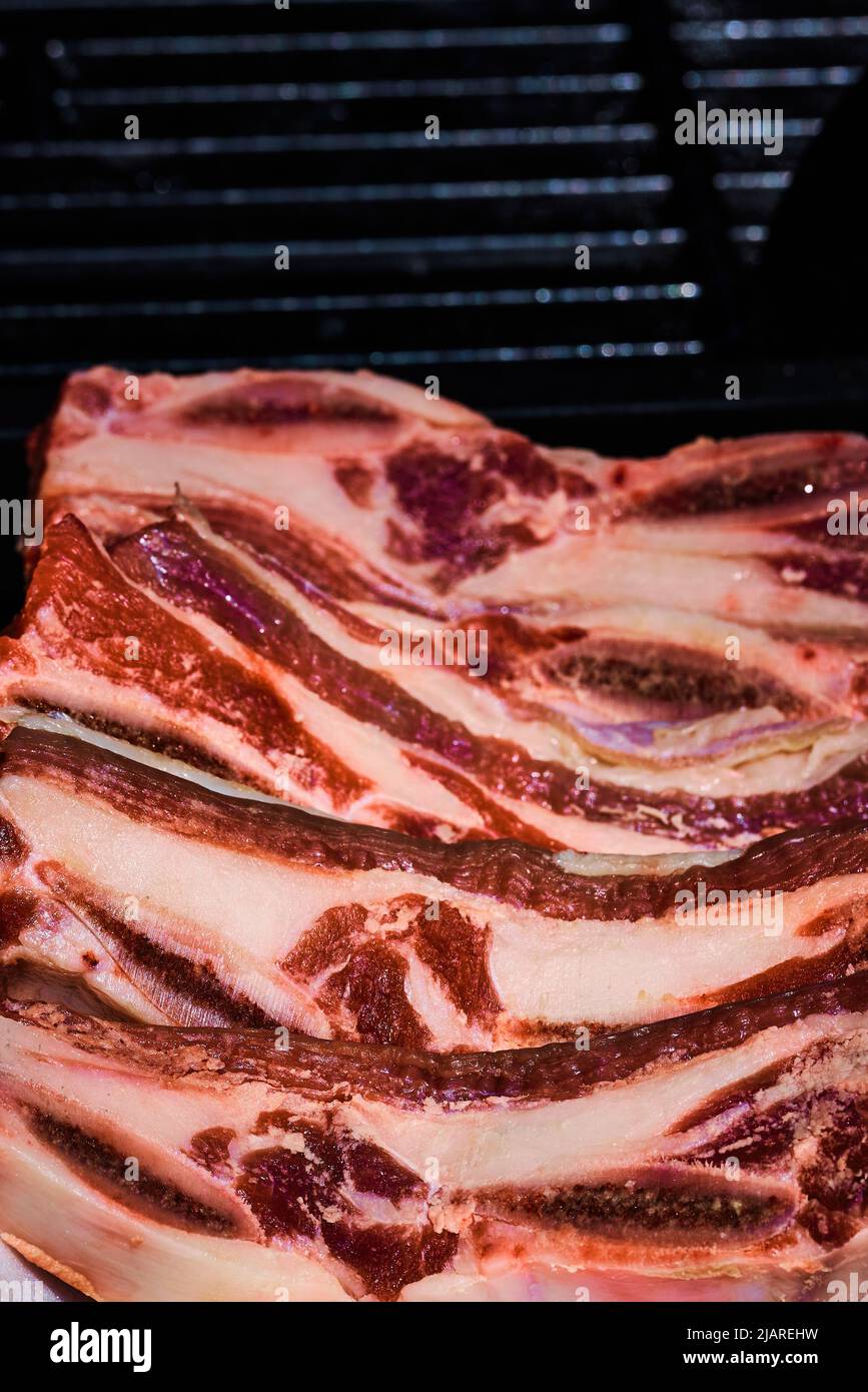 Beef rib meat prepared for grilling on the barbecue Stock Photo - Alamy