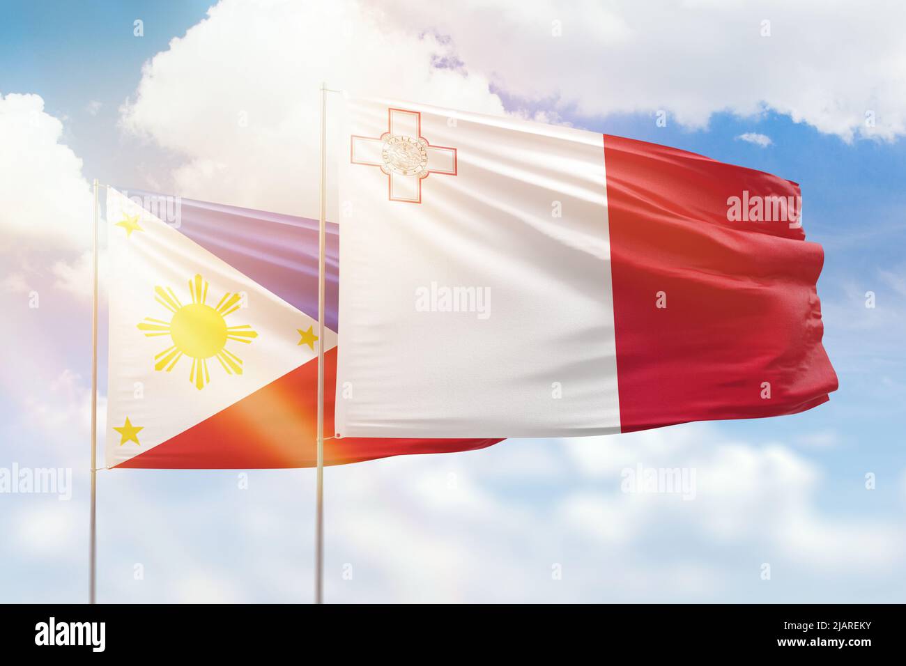 Sunny blue sky and flags of malta and philippines Stock Photo - Alamy