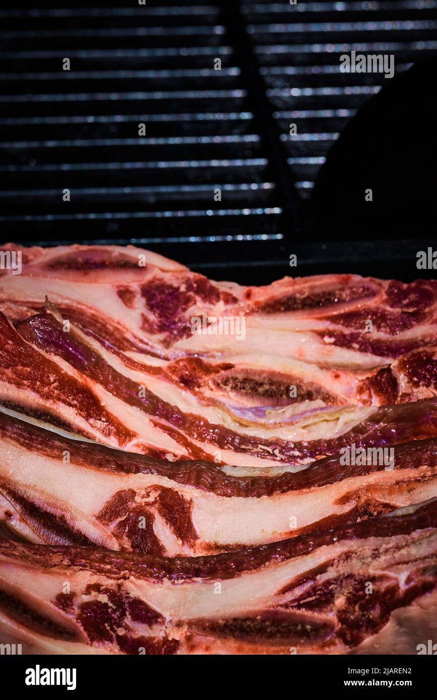 Beef rib meat prepared for grilling on the barbecue Stock Photo - Alamy