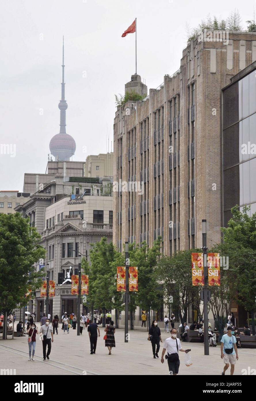 Shanghai, China, June 1, 2022, People wearing face masks walk in ...