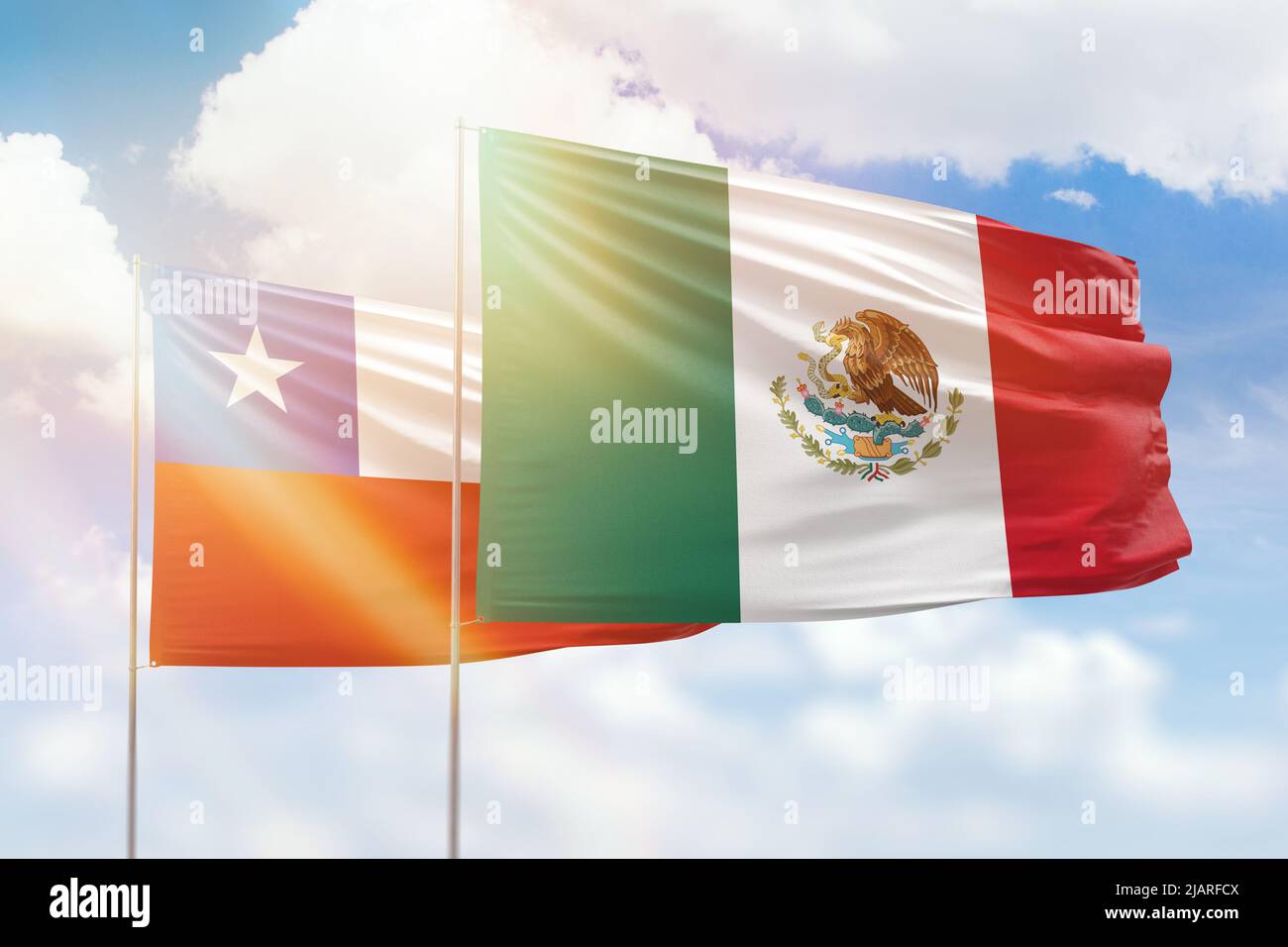 Sunny blue sky and flags of mexico and chile Stock Photo - Alamy