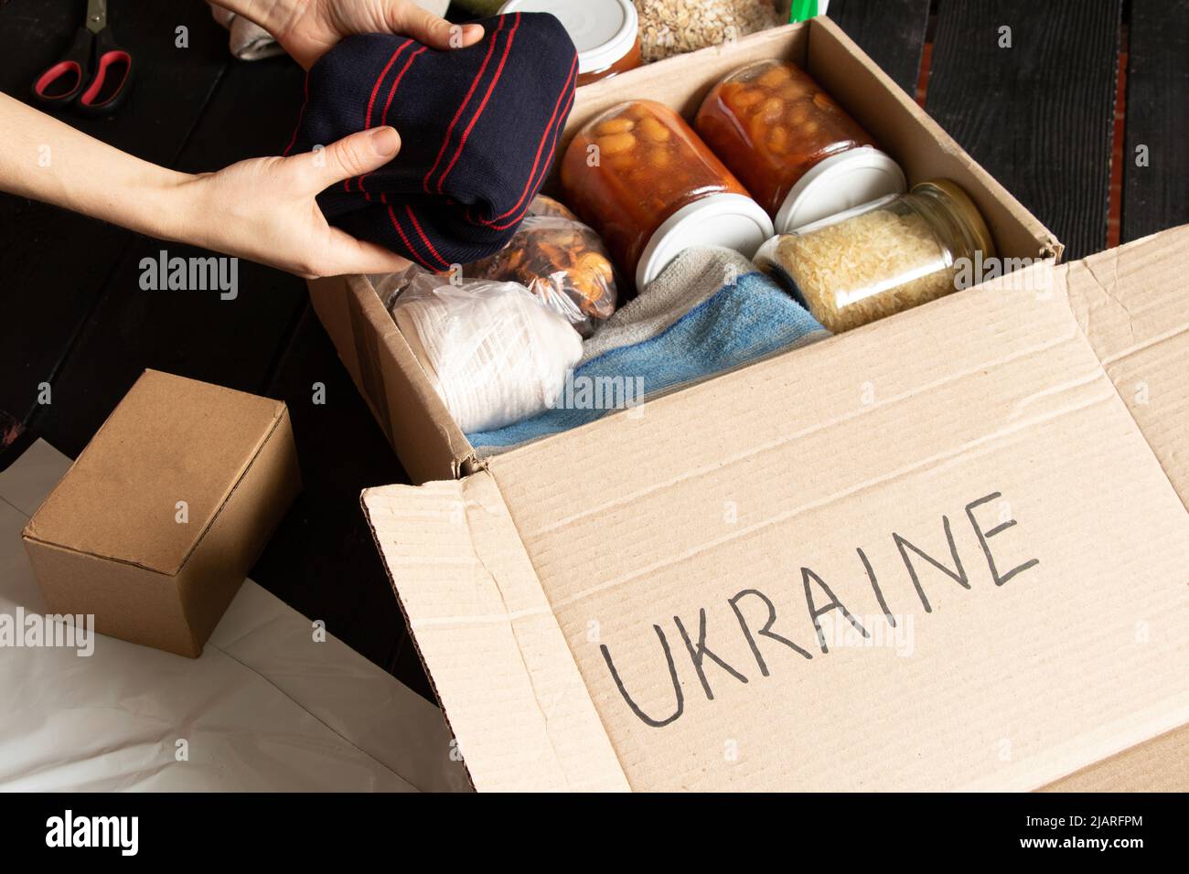 Collecting a humanitarian food set to help people who suffered during ...